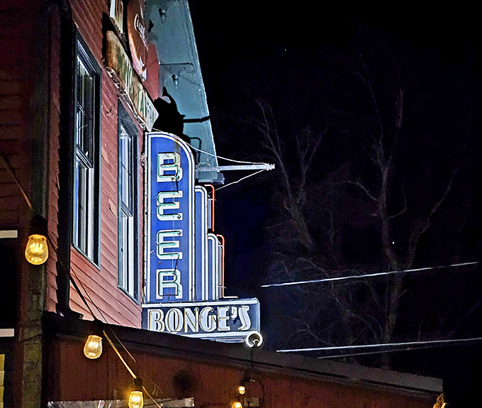 The neon "BEER" sign glows like a beacon in the night, guiding hungry travelers to this temple of Hoosier hospitality.