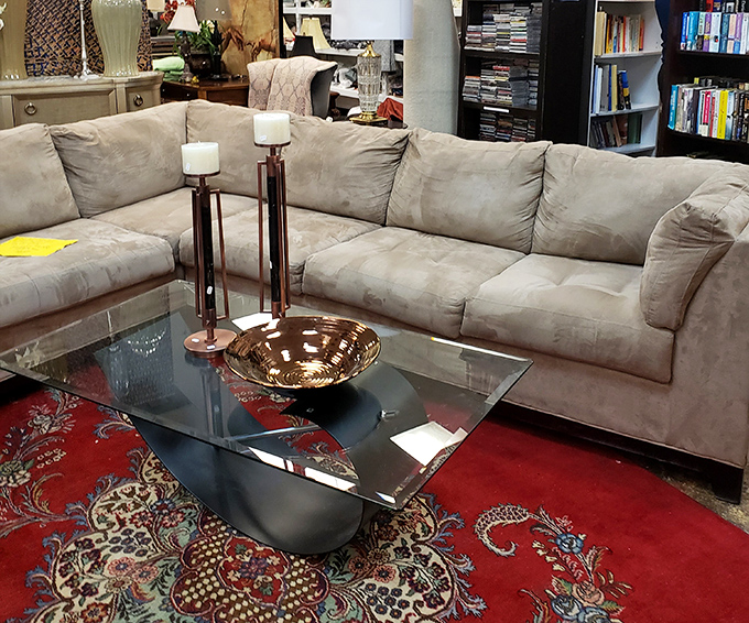 This sectional hasn't just seen some living&mdash;it's ready for your next Netflix marathon. The glass table says "adult" while the comfort screams "nap time."