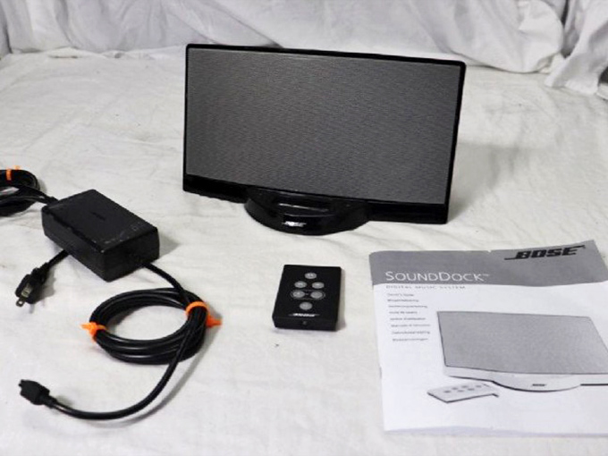High-end audio equipment complete with manual and remote. The thrift gods smiled upon whoever spotted this Bose SoundDock among the everyday electronics.