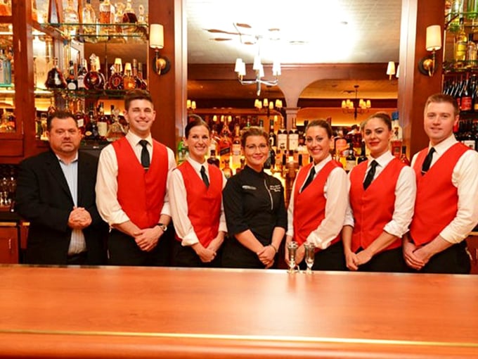 The staff lineup in their signature red vests&mdash;the A-team you want handling your carnivorous adventure.