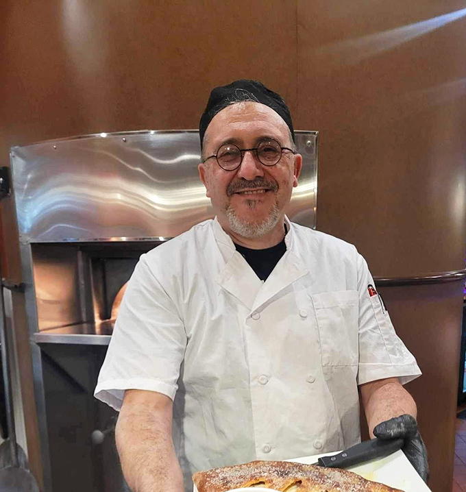 Behind every great meal stands a chef whose smile says everything about passion.