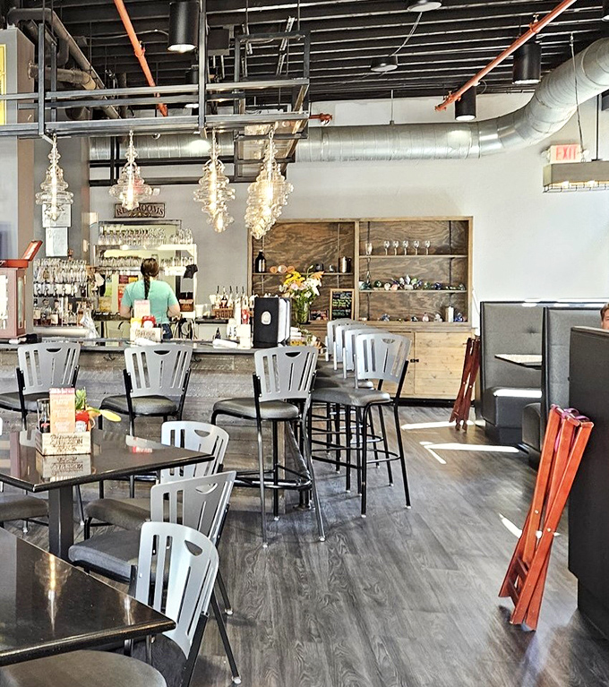 The bar area combines rustic industrial elements with warm lighting, creating the perfect backdrop for both serious conversations and lighthearted banter.