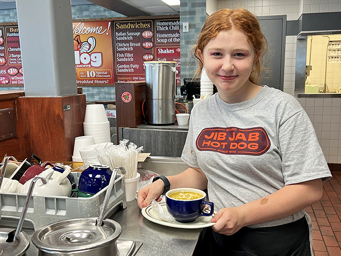 Behind every great hot dog joint is a dedicated team. That smile says, "Yes, our homemade chili really is that good."