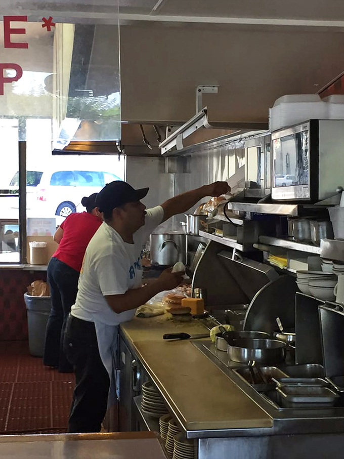 Behind every great burger is a dedicated cook, crafting each order with the precision of a culinary artist.