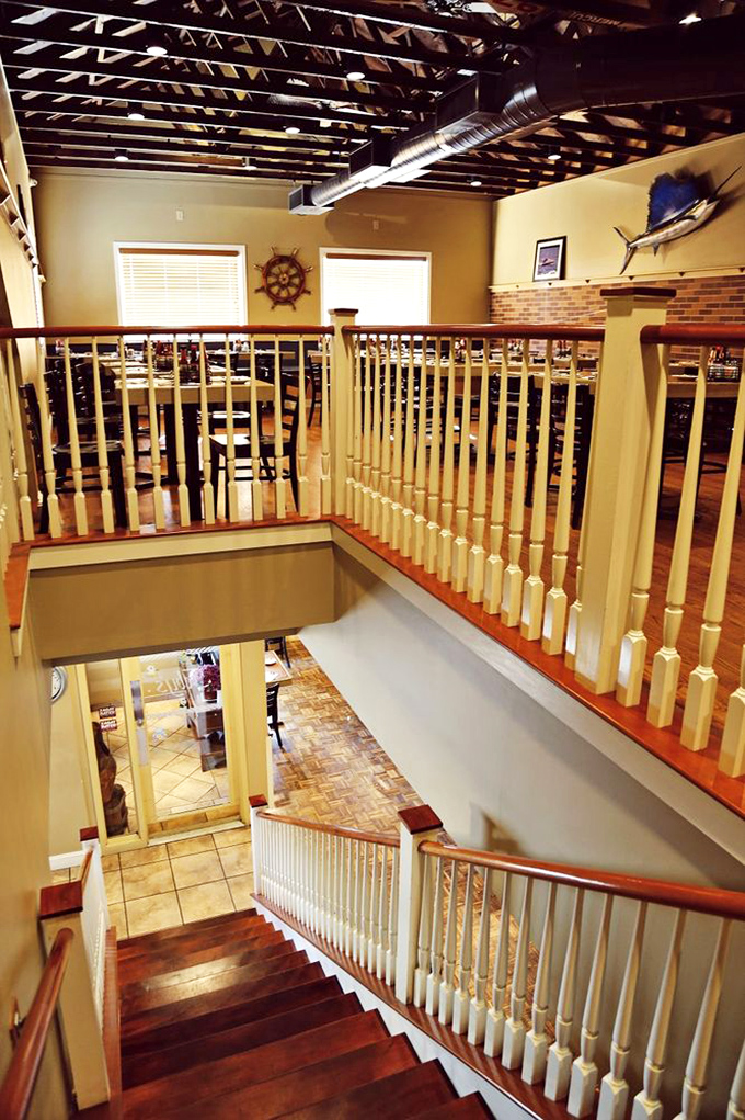 The staircase reveals Feby's surprising spaciousness&mdash;like finding an extra room in your house you never knew existed, but filled with seafood.