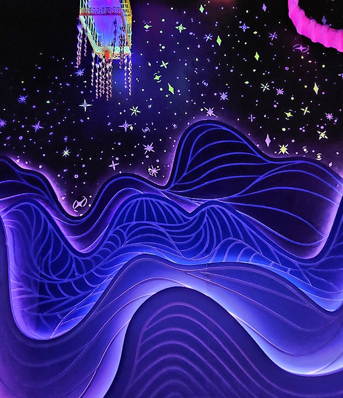 Cosmic waves undulate beneath a starry sky, creating a meditative space where physics and fantasy become indistinguishable.