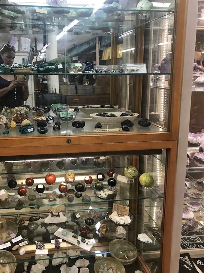 Earth's treasures displayed like edible candies behind glass. These geological wonders are millions of years in the making.