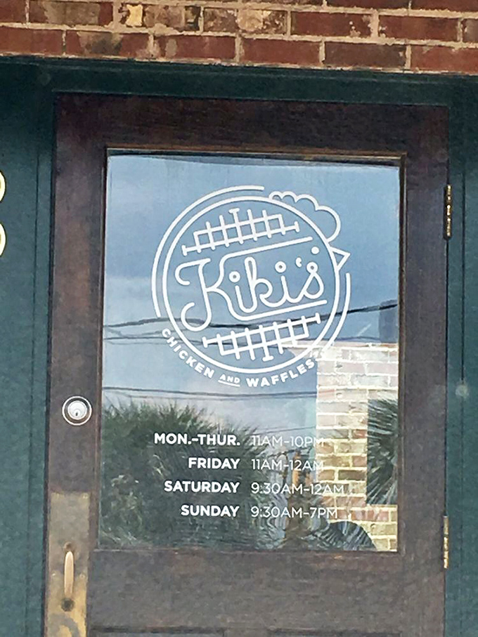 The door tells you everything you need to know: when to come, what to expect, and that iconic waffle logo that promises deliciousness awaits.