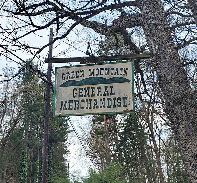 The vintage sign hanging among the trees announces you've found the place. Like a treasure map's X marking the spot.