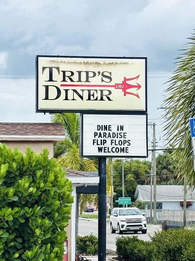 "Dine in Paradise, Flip Flops Welcome"&mdash;the most Florida sign ever. When palm trees frame your diner sign, you know you're in the right place.
