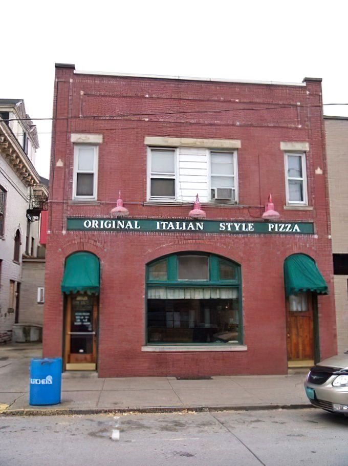 The unassuming storefront on Merchant Street might not catch your eye, but locals know this red brick building houses pizza gold.
