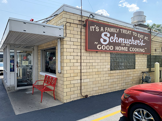 "It's a family treat to eat at Schmucker's" &ndash; the sign promises "Good Home Cooking" and that red bench invites you to sit a spell.