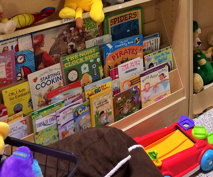 Children's books lined up like colorful soldiers, ready to march into new homes and inspire young imaginations all over again. 
