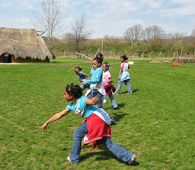 Kids playing ancient games with the enthusiasm of discovering life without screens. Childhood joy transcends centuries at SunWatch.