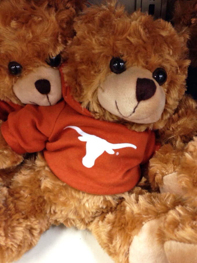 Stuffed bears in college gear because even outlet malls know you need gifts for the sports fans.