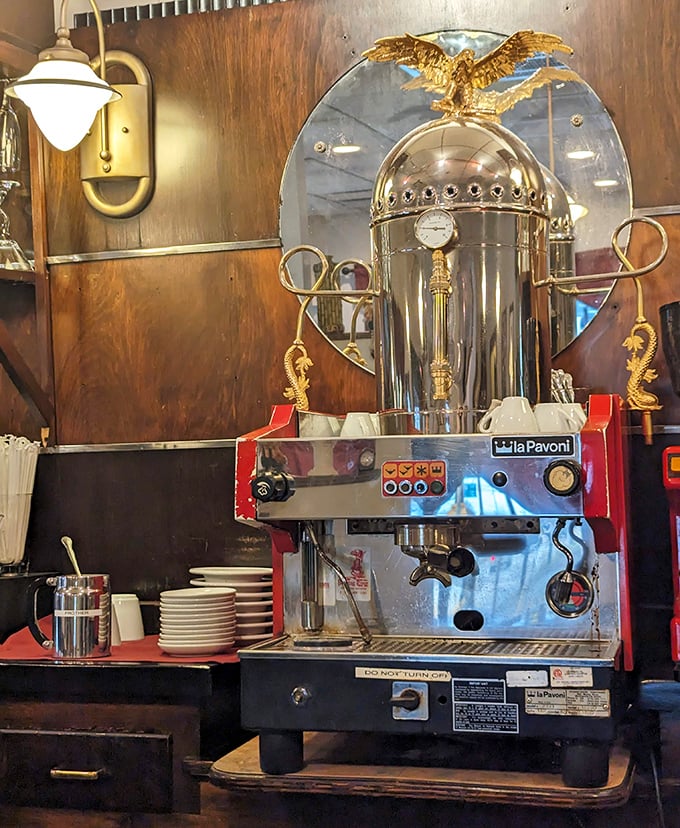 A vintage espresso machine stands like a gleaming sentinel, promising the perfect finale to your Italian feast.
