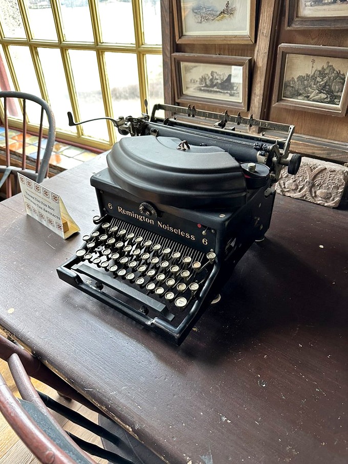A vintage Remington typewriter sits ready for inspiration, a relic from an era when words were measured in mechanical keystrokes.