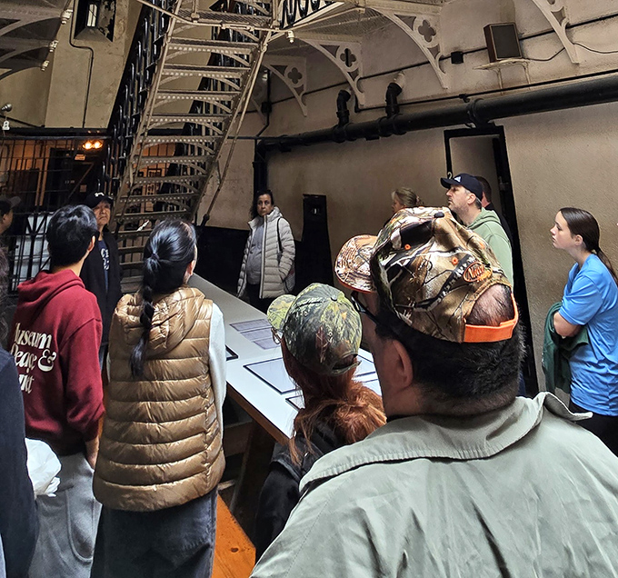 Tour groups gather to hear the haunting stories of the jail's past, their expressions ranging from fascination to "can we leave now?"