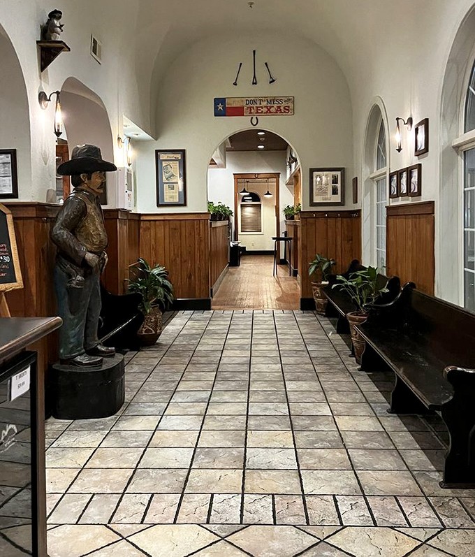 The hallway's Western charm sets the stage for what's to come &ndash; notice the "Don't Mess with Texas" sign, solid advice for both states and steaks.
