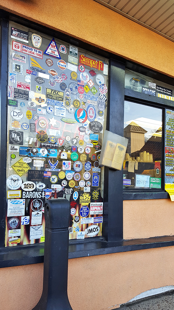 The sticker-covered windows tell stories of loyal customers, local pride, and community connections. It's a scrapbook of memories created over countless delicious meals.