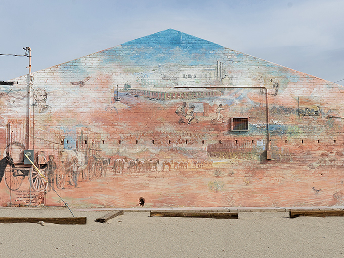 History painted large—this fading mural captures Trona's heritage in sun-bleached colors, a public canvas celebrating the town's enduring spirit.