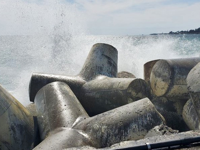 When winter storms arrive, these massive concrete tetrapods transform from odd sculptures into essential guardians, absorbing the ocean's fury. 