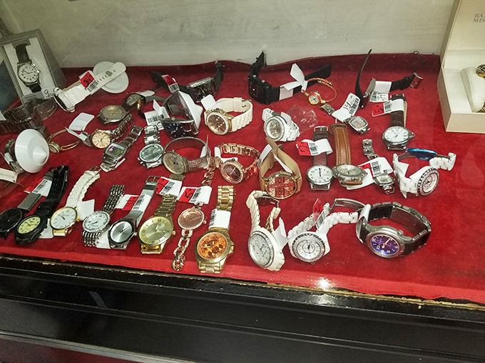 Timepieces paused at different moments in history, displayed on red velvet like jewelry box refugees.
