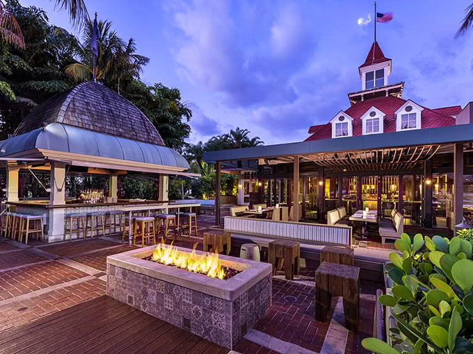 Fire and twilight magic! Boatyard's elegant outdoor lounge with its glowing fire pit creates the perfect ambiance for sipping cocktails under Florida's purple skies.