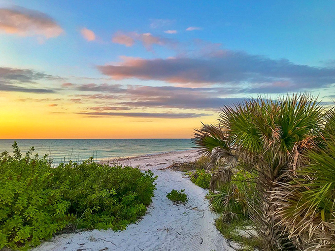 Miles of sugar-white sand stretch along calm Gulf waters, perfect for romantic sunset strolls.