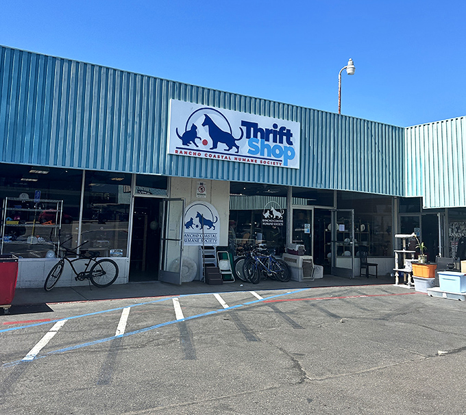 The Thrift Shop's blue and white building houses treasures that help local animals - shopping with a heartwarming purpose.