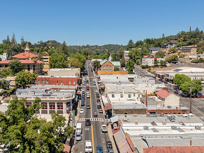 Mountain living meets desert beauty where wind farms dance across hills like modern art.