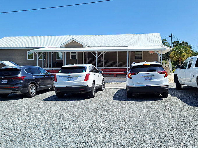 The clean white exterior sets the scene as a hungry customer pulls up, eager for coastal Carolina flavors.