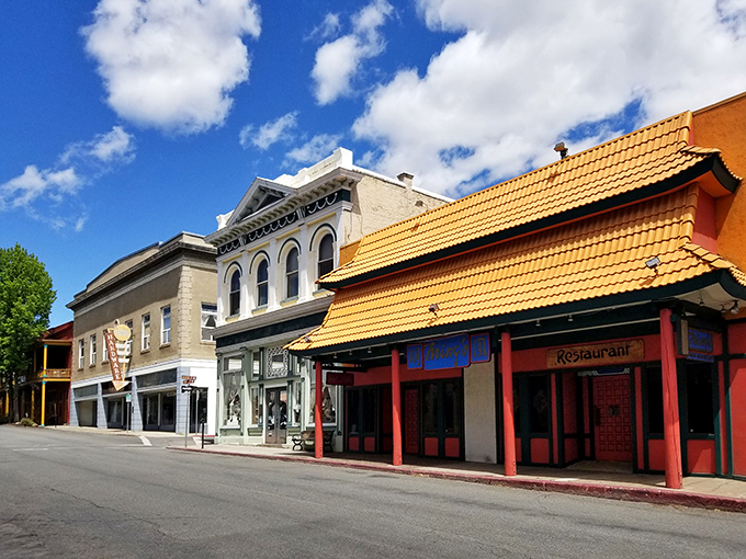 Cultural fusion! Yreka's street showcases an unexpected orange-roofed pagoda style restaurant that stands out like a peacock at a pigeon convention.