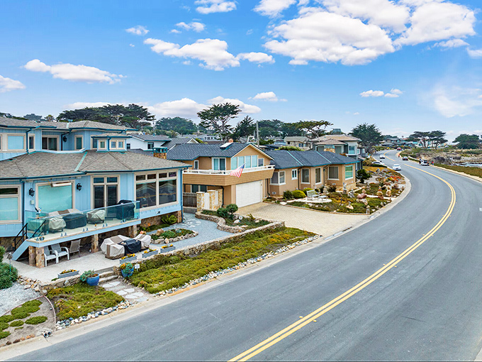 Pacific Grove's Victorian houses climb hillsides above Asilomar Beach, where monarch butterflies winter among America's last hometown charm and elegance.