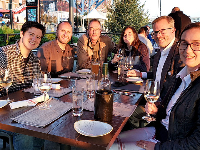 The patio at sunset is where memories are made. Notice how everyone's wine glasses are half-full&mdash;the universal sign of a good time in progress.
