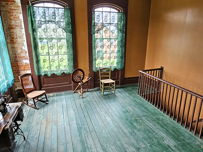 Upper floors where spinning wheels and period furniture create authentic glimpses into 19th-century domestic life.