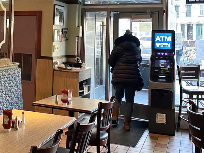Even the ATM looks like it belongs in this temple of tradition, ready to fund your journey through Little Pete's extensive menu.