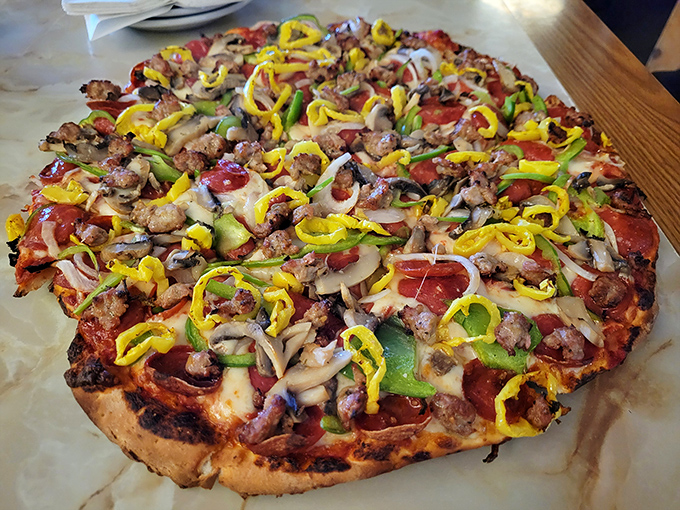 The "All The Way" pizza lives up to its ambitious name with a carnival of toppings that somehow work together like a well-rehearsed band.