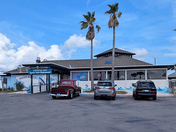 Beachside dining perfection: Where painted sea creatures on the walls hint at what's fresh on your plate, and palm trees stand guard over parking spots worth fighting for.