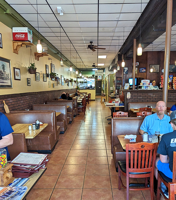 The dining room stretches back like a portal through time, with booths that have cradled generations of Floridians through countless cups of coffee.