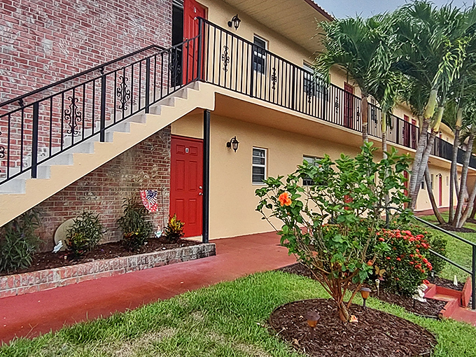Cheerful red doors welcome residents home. Where "curb appeal" isn't just a real estate term&mdash;it's the community philosophy.