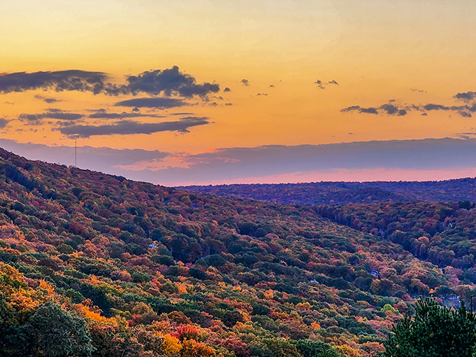 Autumn in the Poconos transforms the mountains into a patchwork quilt of crimson and gold under skies painted with sunset fire.