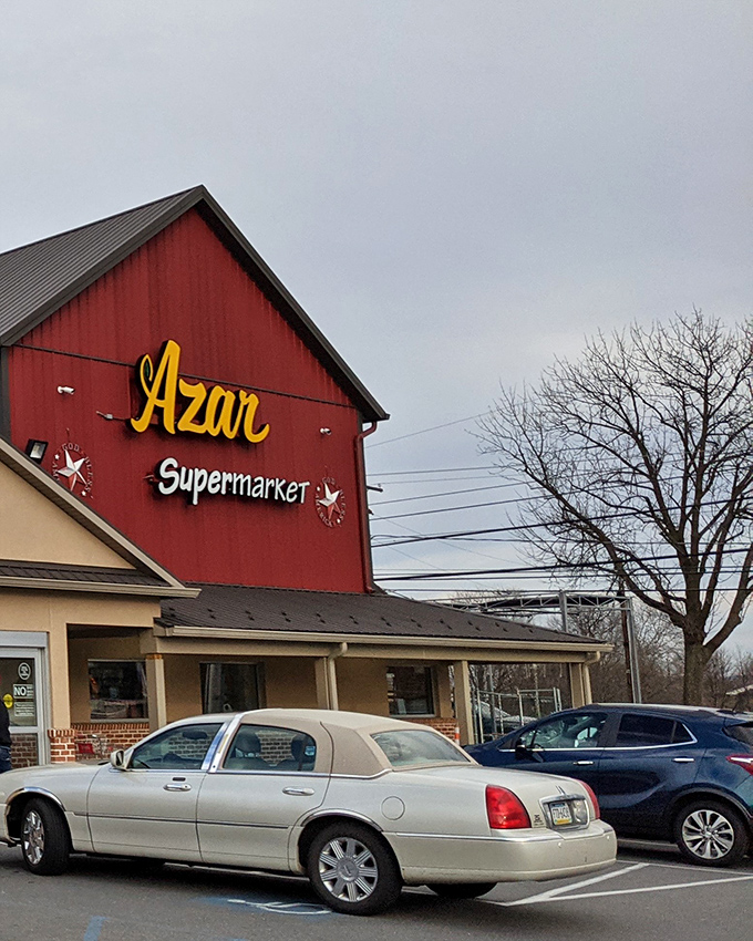 Azar Supermarket's cheerful red exterior promises culinary adventures beyond the ordinary grocery experience, a local gem hiding in plain sight.