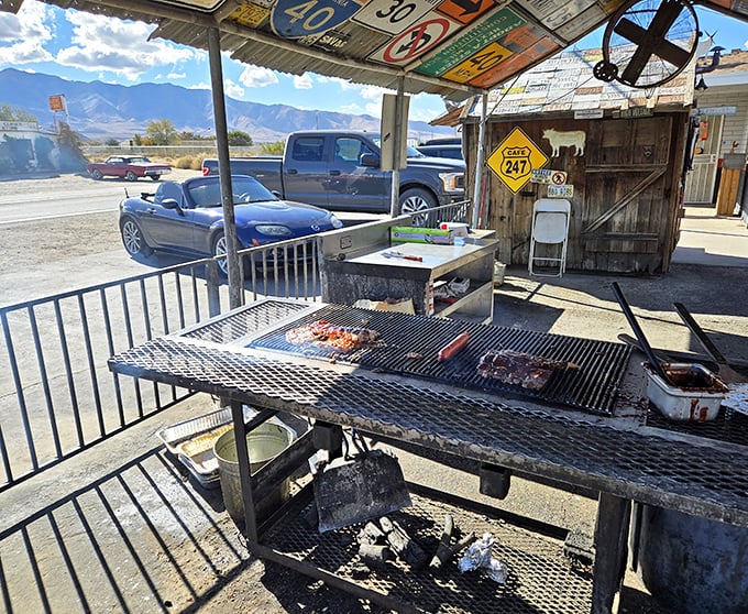 BBQ with a view of the mountains &ndash; meat meets heat while nature provides the backdrop. That's not smoke, it's flavor becoming airborne.