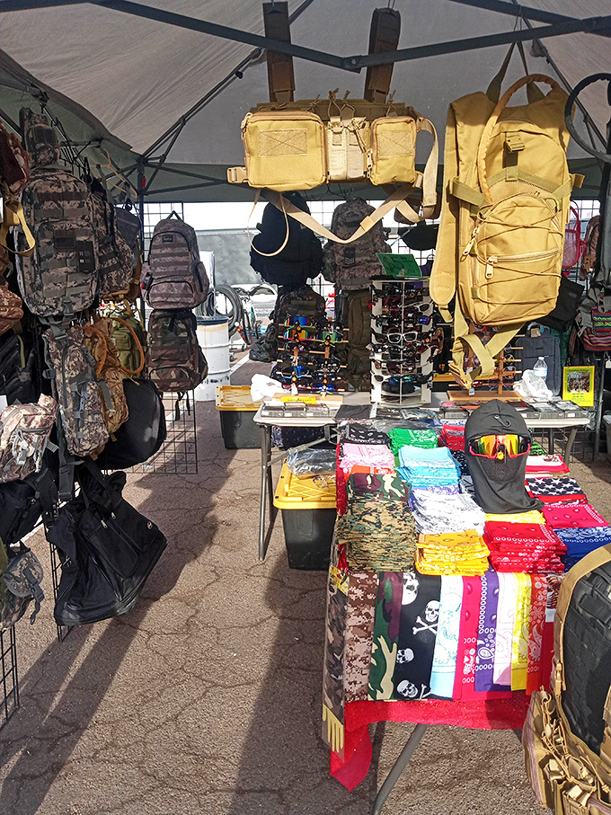 Tactical gear and bandanas create a colorful military-inspired display. Desert survivalists and fashion-forward shoppers find common ground in these practical accessories.