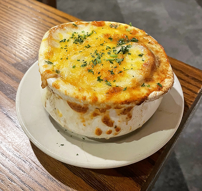 French onion soup that's had a passionate affair with cheese &ndash; their bubbling romance sealed under a golden broiled crust.