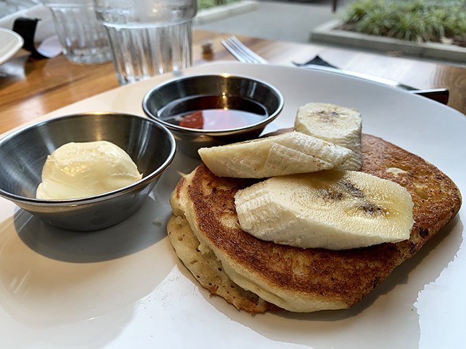 Pancakes that make you question why we ever invented other breakfast foods. That banana looks like it found its true purpose in life.