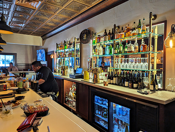 A bar stocked like a liquid library where every bottle tells a different story. The illuminated shelves aren't just practical&mdash;they're showcasing liquid possibilities.