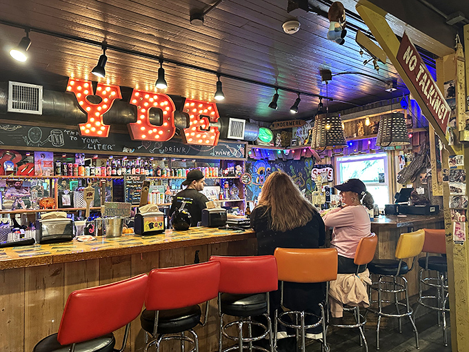 The illuminated "YDE" sign presides over a bar that understands good food deserves equally good drinks. This is where sandwich dreams come true.