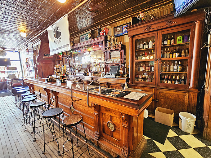 A bar top polished by thousands of elbows tells more stories than any history book. The pressed tin ceiling has absorbed decades of laughter and secrets. 